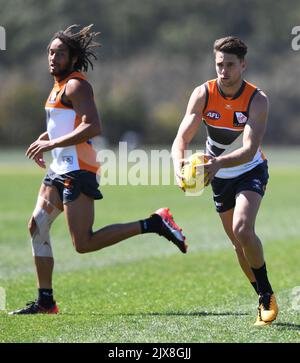Josh Kelly of the Giants runs with the ball during the Round 22 AFL ...