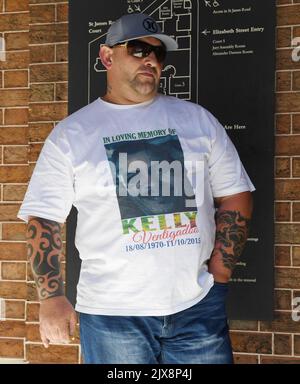 An man wears a t-shirt in memory of Miami defensive lineman Bryan Pata ...