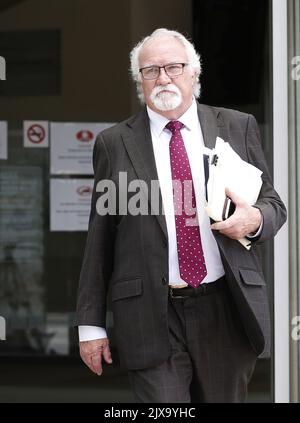 Former Olympic swimmer Neil Brooks talks to the media outside a watch ...