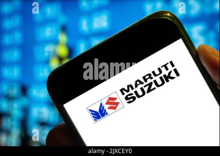 In this photo illustration, the Maruti Suzuki logo is seen displayed on ...