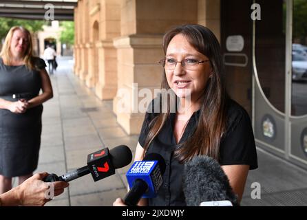 Jenny Hallam speaks to the media outside the District Court in Adelaide ...
