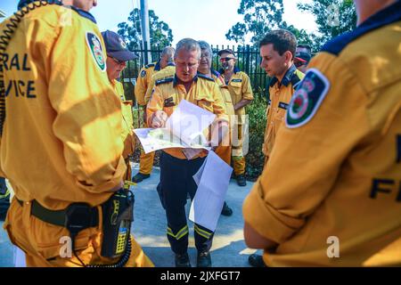 Volunteer fire fighters are seen on duty at Menai Rural Fire Service ...