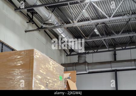Ceiling of large factory building with artificial lighting. Industrial ...