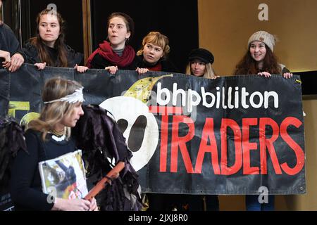 Protesters are seen outside of the BHP offices along Collins Street in ...