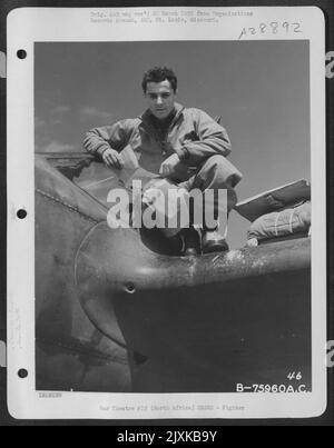 A pilot of the 90th Photographic Reconnaissance Wing, poses beside his ...