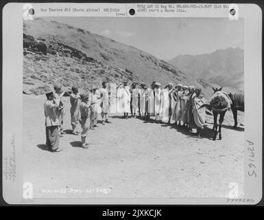 Native guides and U.S. military personnel move toward Marrakech, North ...