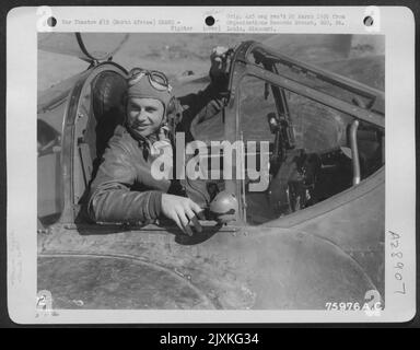 A pilot of the 90th Photographic Reconnaissance Wing poses on his ...