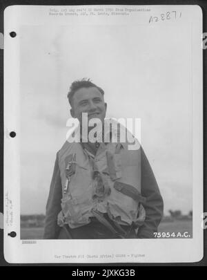 A pilot of the 90th Photographic Reconnaissance Wing, seated in the ...