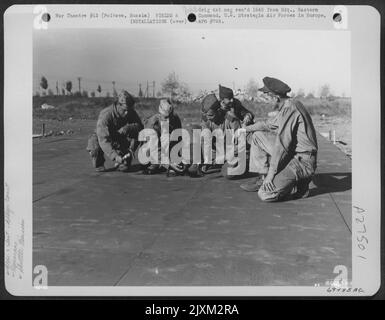American GI's and Russian soldiers work together in construction of ...