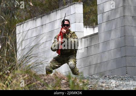 Soldiers from Australia's 7th Combat Brigade carry a US marine playing ...