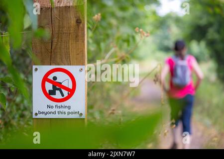 No Fishing Sign from the Canal and River Trust with boats moored in the ...