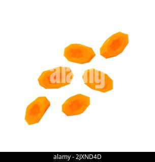 Fresh carrot slices falling on white background Stock Photo - Alamy
