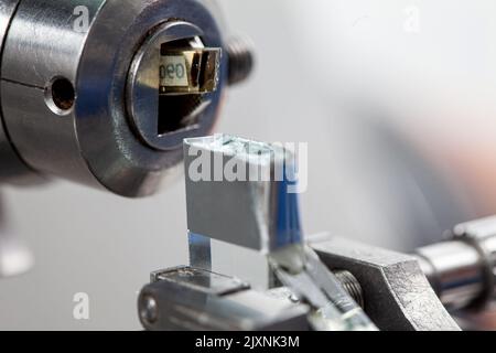 Closeup of an epoxy embedded tissue placed on the ultramicrotome to ...