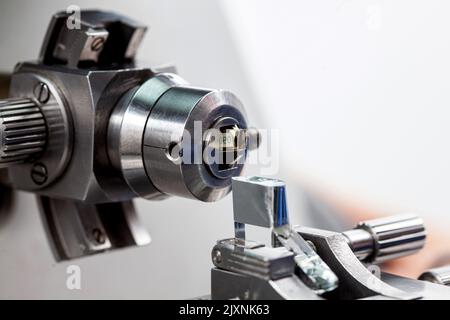 Closeup of an epoxy embedded tissue placed on the ultramicrotome to ...