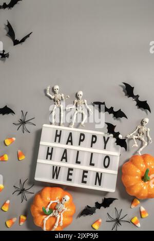 Happy Halloween lightbox sign board with pumpkin, bats and candy on a ...