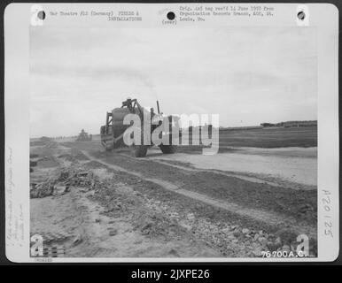 A Scraper Operated By A Member Of The 834Th Engineer Aviation Battalion ...