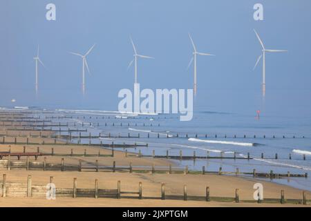 Groynes on the beach at Redcar with wind turbines in the distance Stock ...