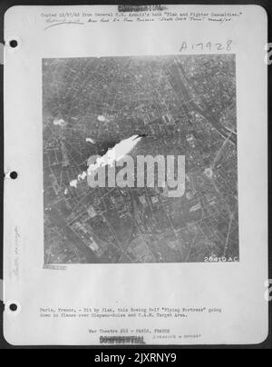 This B-17 Flying Fortress has just been hit by flak after having ...