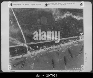 Men And Assault Vehicles Storm The Beaches Of Normandy As Allied ...