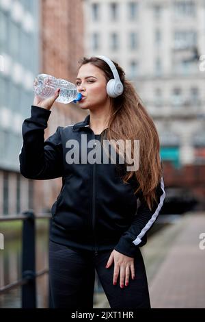A single female jogger on the streets of Manchester, UK Stock Photo - Alamy