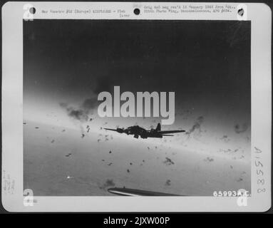 Bursts of deadly flak explode around a formation of Boeing B-17 Flying ...