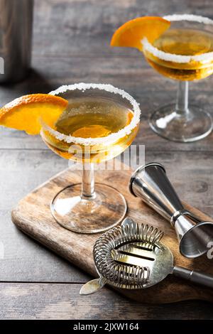 Sidecar cocktail with a sugar rim on wooden table Stock Photo - Alamy