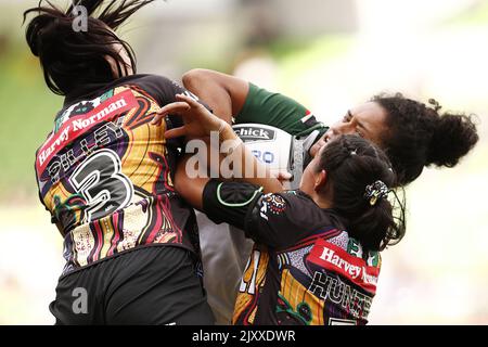 Zahara Temara of the New Zealand Maori Ferns is tackled by Amber Pilley ...
