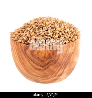 Utsho suneli seeds in wooden spoon, isolated on white background ...