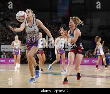Tegan Philip of the Vixens and Kim Jenner of the Firebirds compete for ...