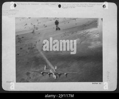 B-24 Liberator Through flak and over the destruction created by ...