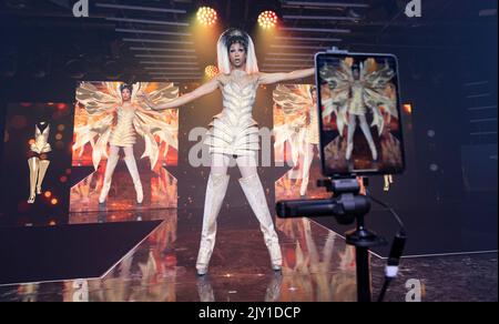 EDITORIAL USE ONLY Drag queen Tia Kofi wearing a dress designed by Sal ...