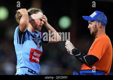 Kirra Dibb of NSW receives attention for a cut to the head during the ...