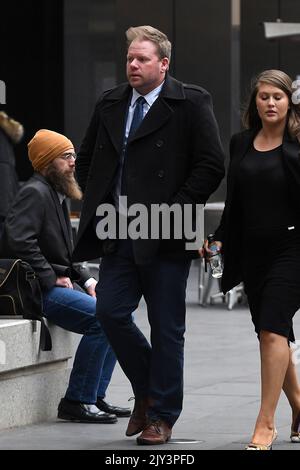 Nick Stevens (centre) arrives to the County Court of Victoria in ...