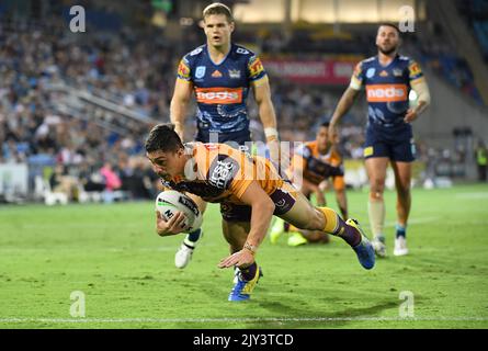Kotoni Staggs of the Broncos scores the match winning try during the ...