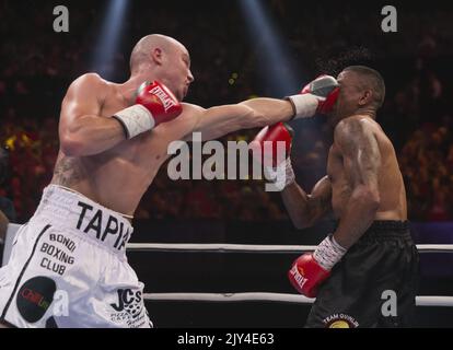 Cesar Mateo Tapia hits Renold Quinlan during their fight for the ...
