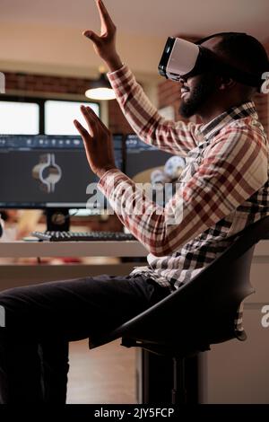 Developer using vr goggles to manufacture gears product with virtual ...