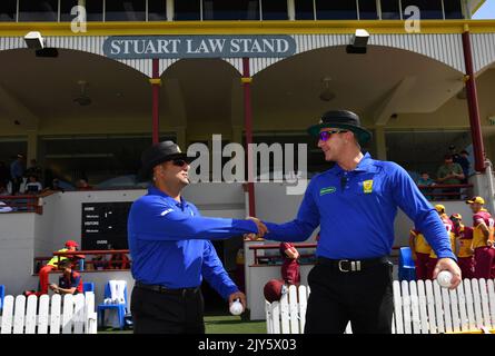 Umpires Gerard Abood (left) and Donovan Koch (right) are seen during ...