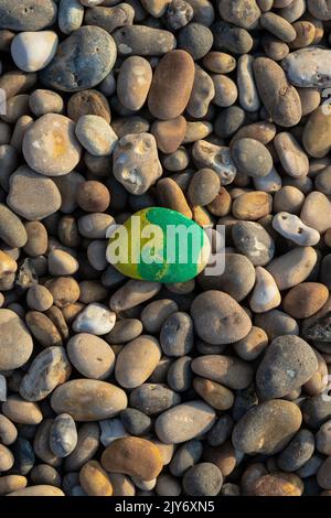Single round stone on the beach Stock Photo - Alamy