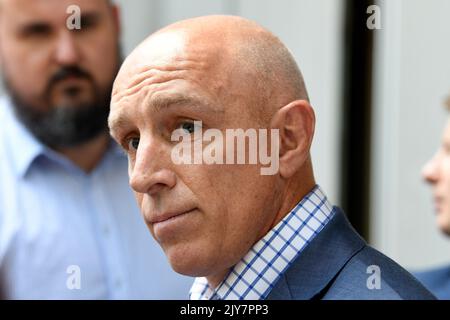 Manley Sea Eagles football manger John Bonasera (left) and lawyer Elias ...