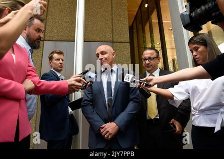 Manley Sea Eagles football manger John Bonasera (left) and lawyer Elias ...