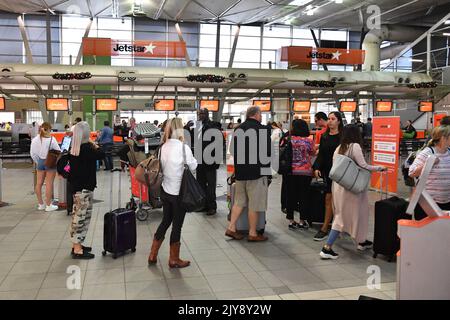 Passengers are seen at the Jetstar check in counters at Sydney Domestic ...