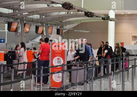 Passengers are seen at the Jetstar check in counters at Sydney Domestic ...