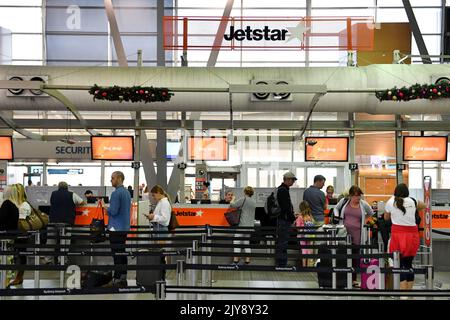 Passengers are seen at the Jetstar check in counters at Sydney Domestic ...