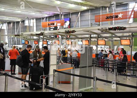 Passengers are seen at the Jetstar check in counters at Sydney Domestic ...