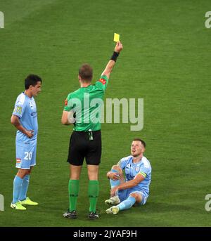Craig Noone of Melbourne City fouls Joel Chianese of Perth Glory and ...