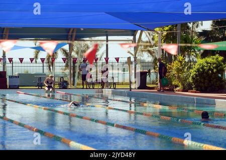 Swimmers are seen at the Nightcliff Swimming Pool in Darwin, Friday ...