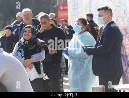 Iman Bekim Hasani (right) of the Albanian Mosque in Carlton helps out ...