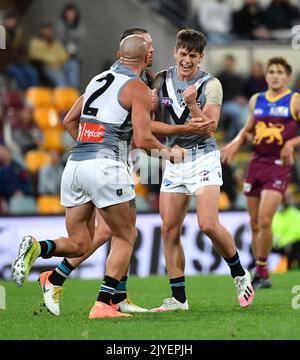Zak Butters (right) of the Power celebrates kicking a goal with Sam ...
