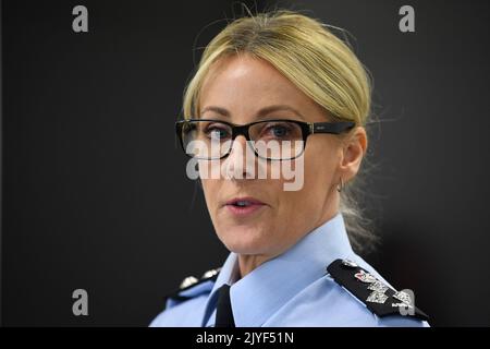 Australian Federal Police (AFP) investigators leave the main entrance ...
