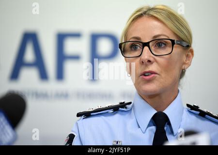 Australian Federal Police (AFP) investigators leave the main entrance ...
